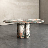 The Kachi Table with a unique wavy solid base