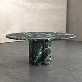 The Kachi Table with a unique wavy solid base