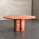 The Kachi Table with a unique wavy solid base