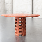 Round Brace Customizable Stone Dining Table features a unique design